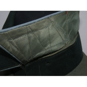 German Wehrmacht officer's tunic with a dark green collar and blue piping